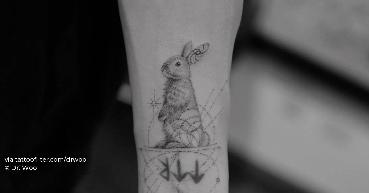 Micro-realistic rabbit tattoo located on the wrist.