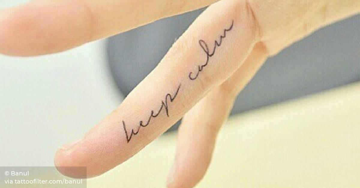 "Keep calm" finger tattoo.