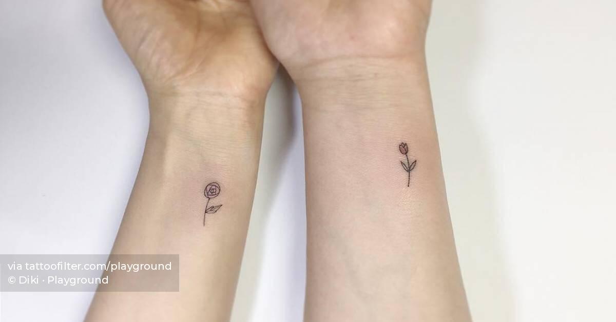 Matching flowers tattooed on best friends.