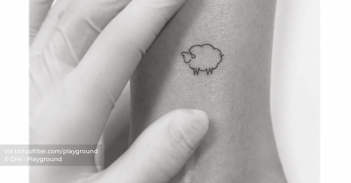 Tattoo of a lilttle minimalistic sheep done on the