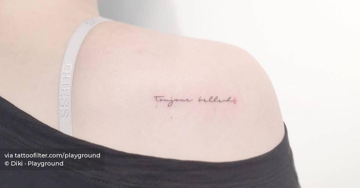 "Toujour belle" lettering tattoo handwritten on the