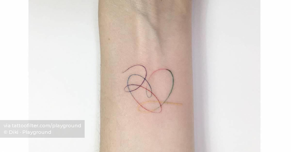 BTS spctrum heart tattoo located on the wrist.