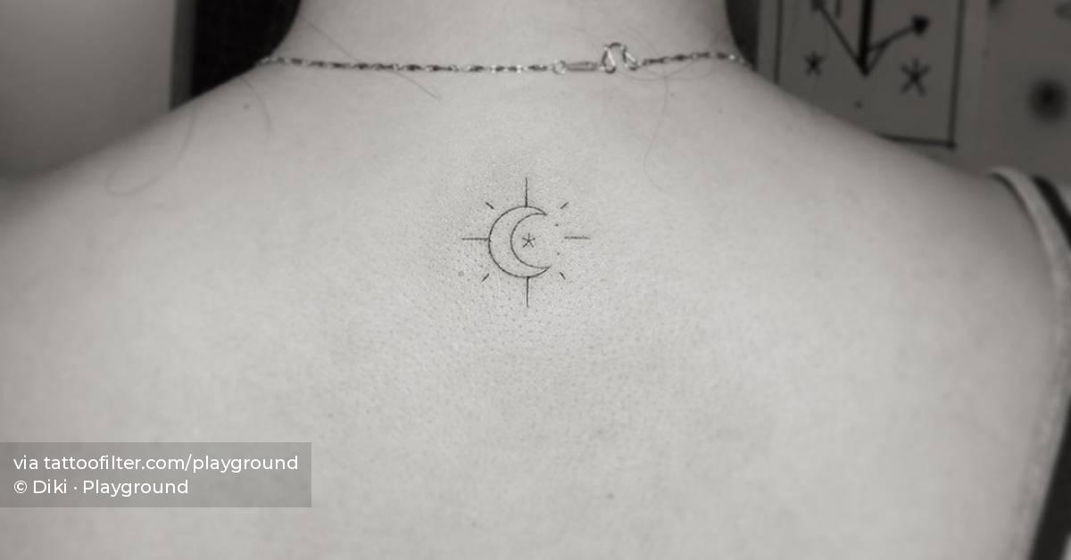 Eclipse tattoo done on the upper arm, minimalistic