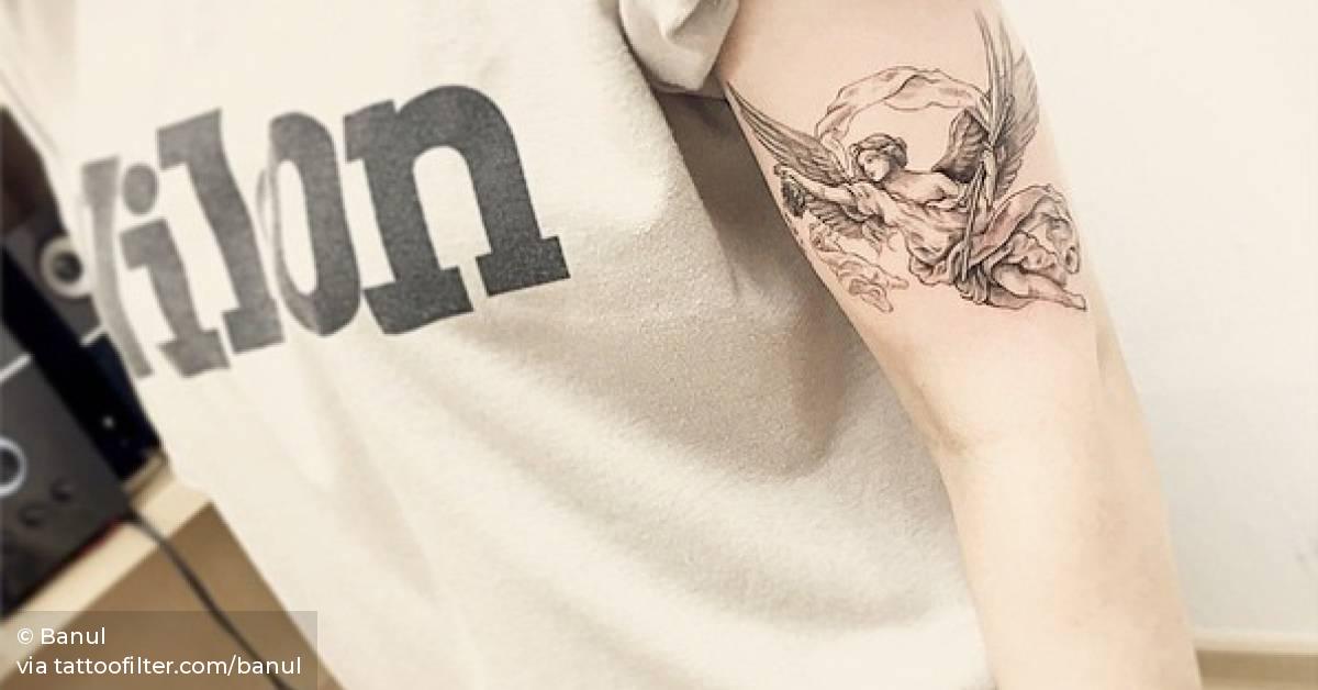 Illustrative style angel tattoo on the left upper arm.
