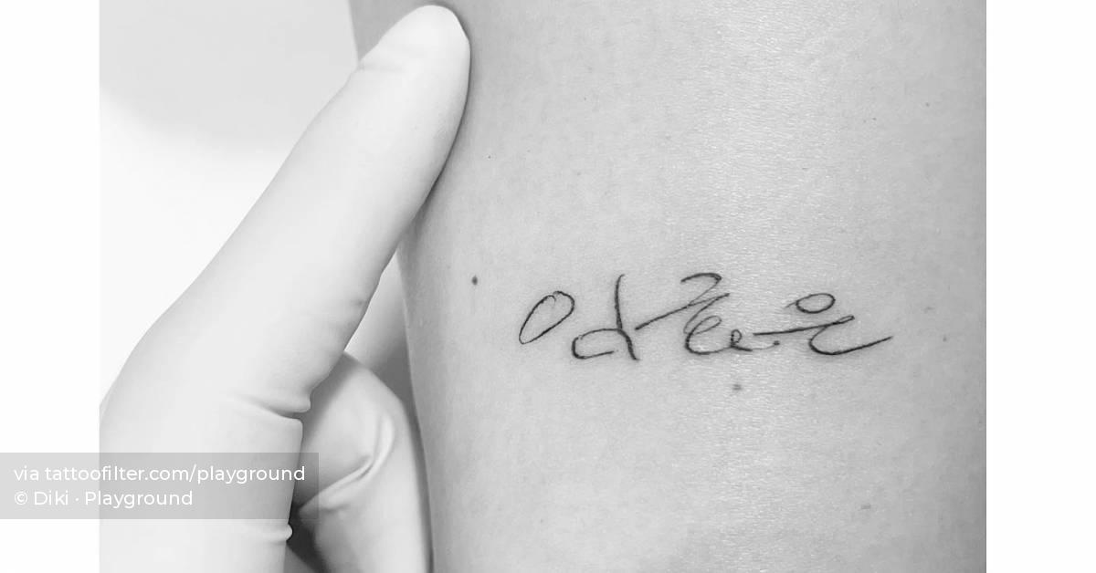 Signature tattoo located on the tricep
