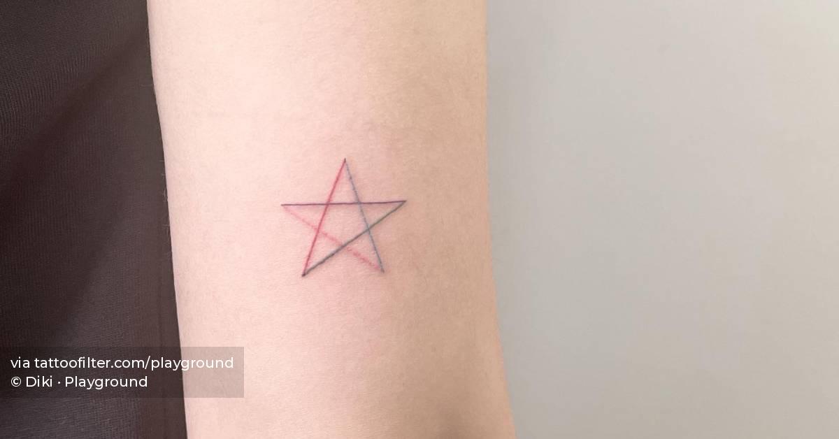 Fine line style spectrum star tattoo located on the