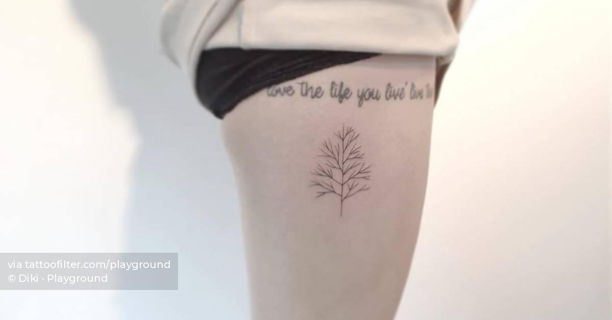 Leafless tree tattoo placed on the thigh, minimalistic