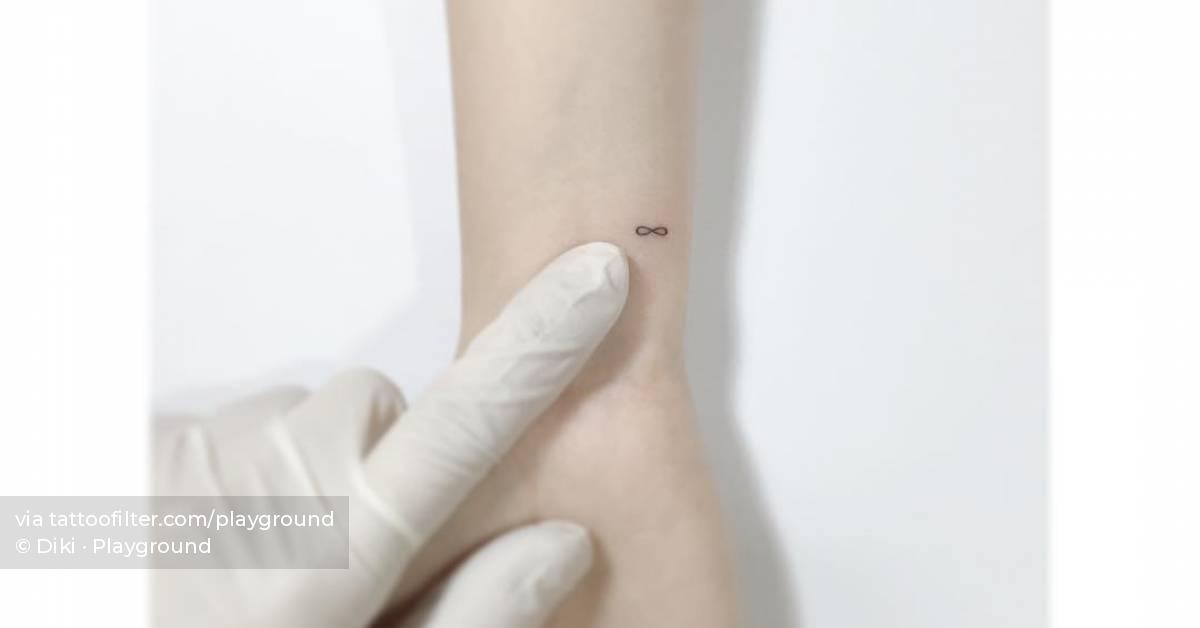Infinity symbol tattoo located on the wrist.