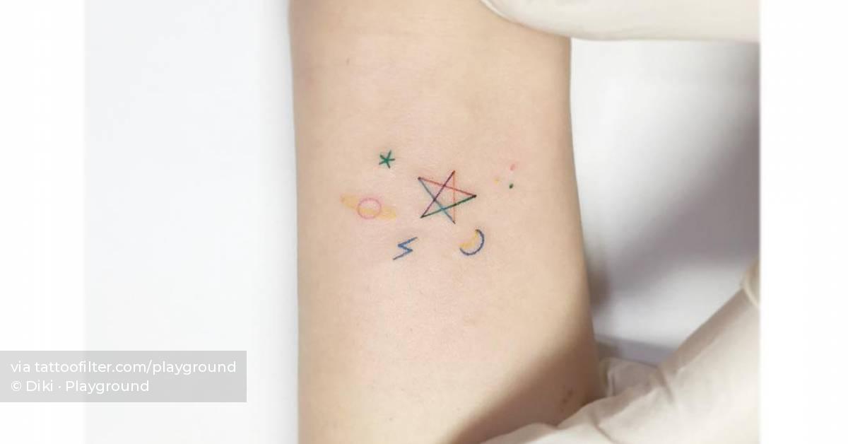 Colorful minimalistic universe tattooed on the wrist.