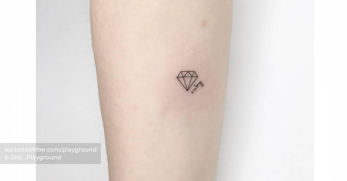 Minimalistic diamond and name "Ruby" tattooed on the