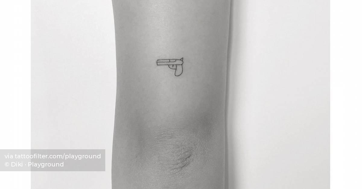 Minimalistic style gun tattooed on the tricep.