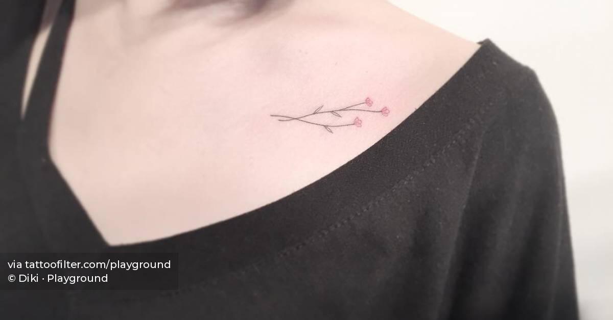Flowers tattoo located on the chest, minimalistic