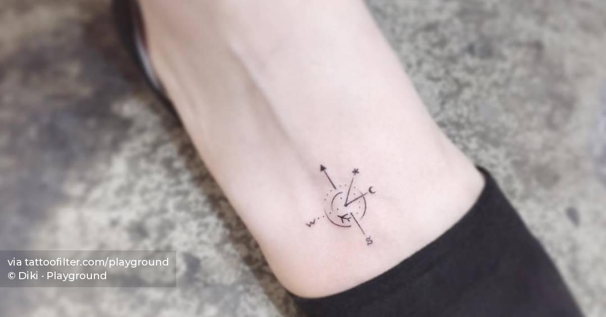 Minimalistic compass rose tattoo done on the foot.