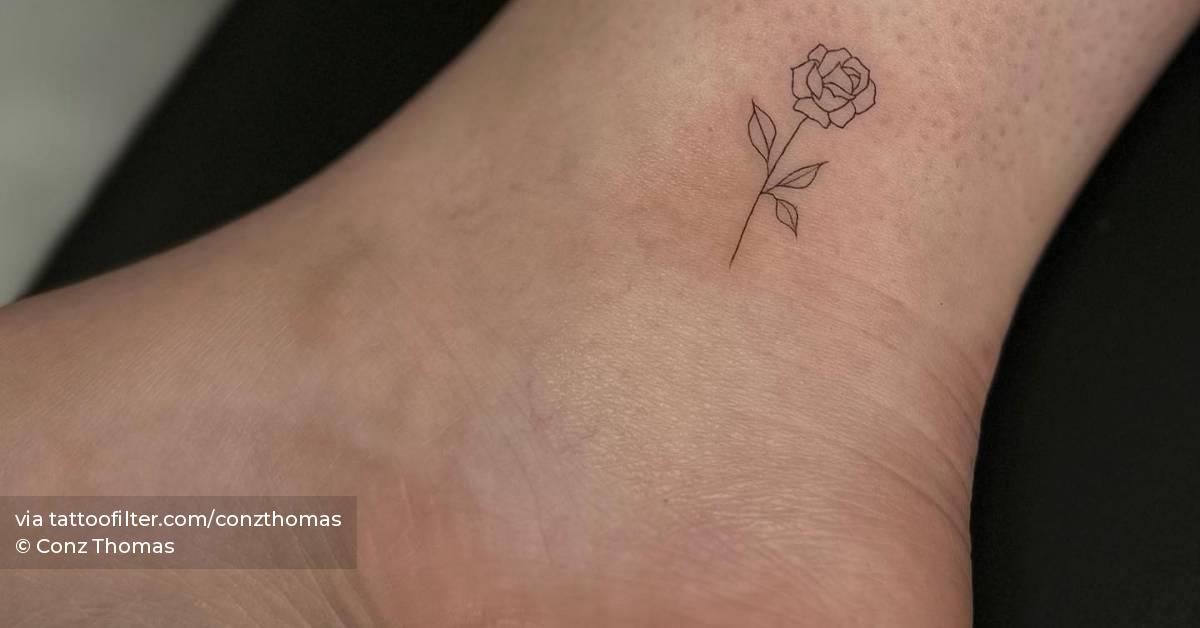 Fine line rose tattoo placed on the ankle, minimalistic