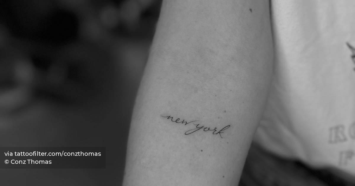 "New York" lettering tattoo located on the inner