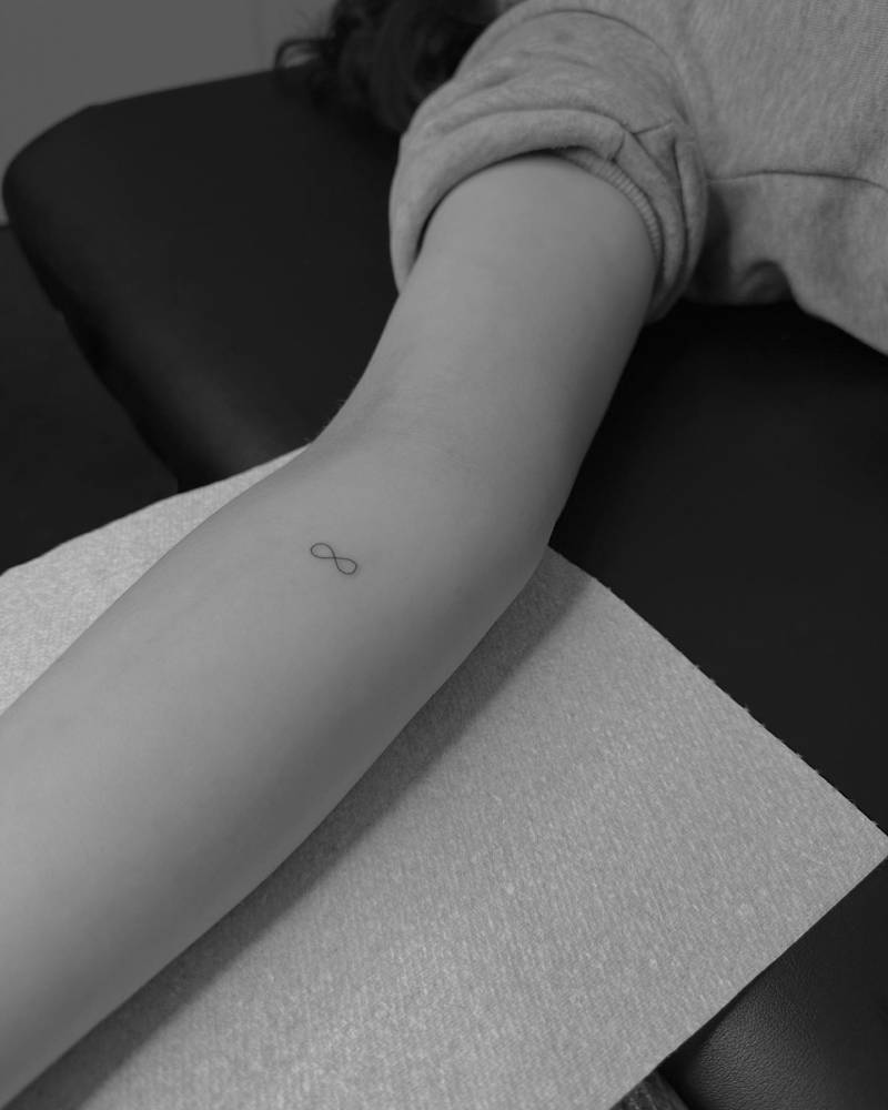 Tiny Minimalistic Infinity Symbol Tattoo Located On The