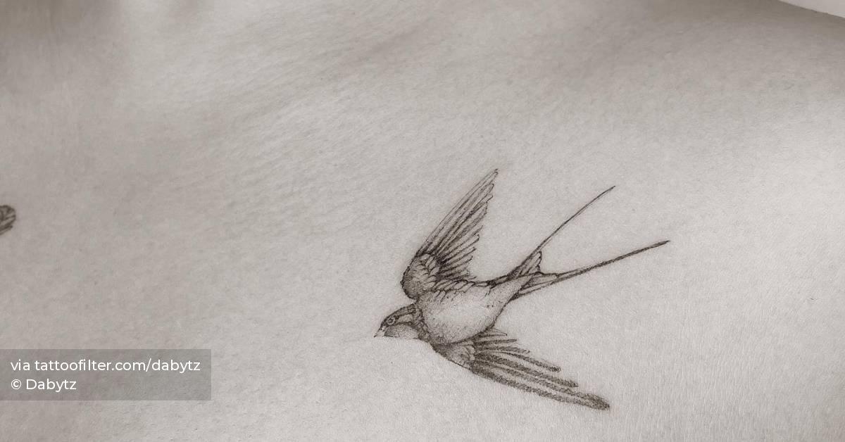 Micro-realistic tattoo of a swallow located on the