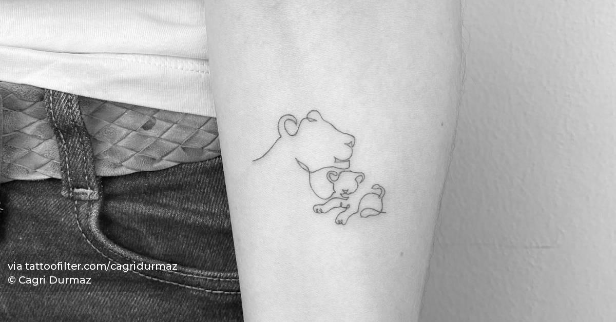 One line lioness and cub tattooed on the inner forearm.