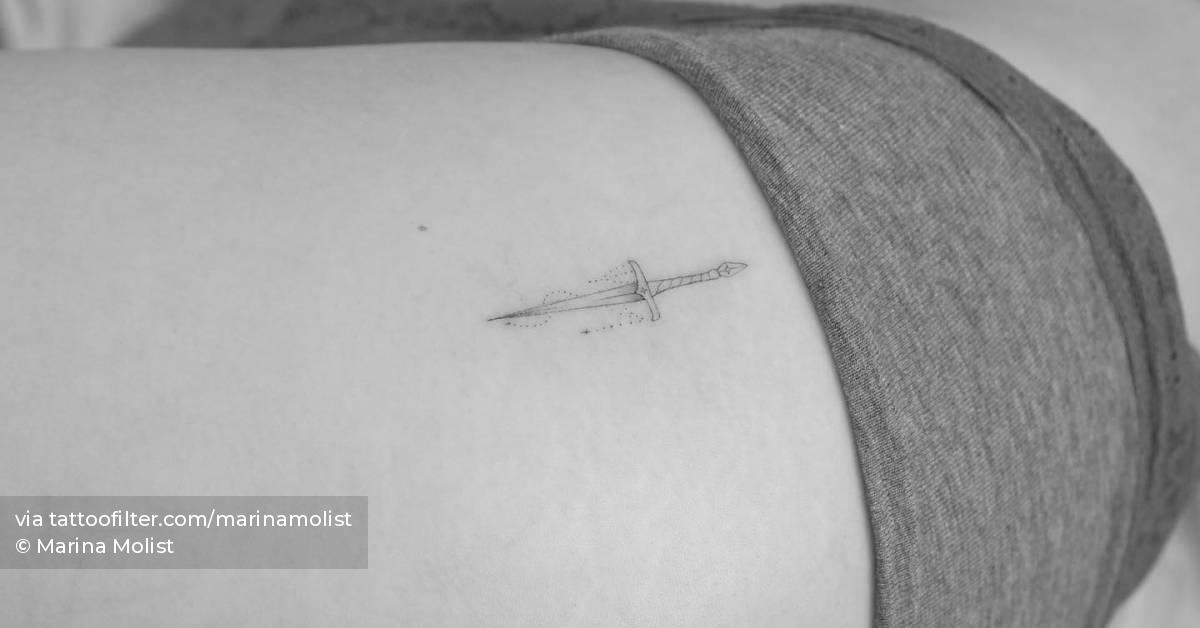 Single needle dagger tattoo done on the hip.