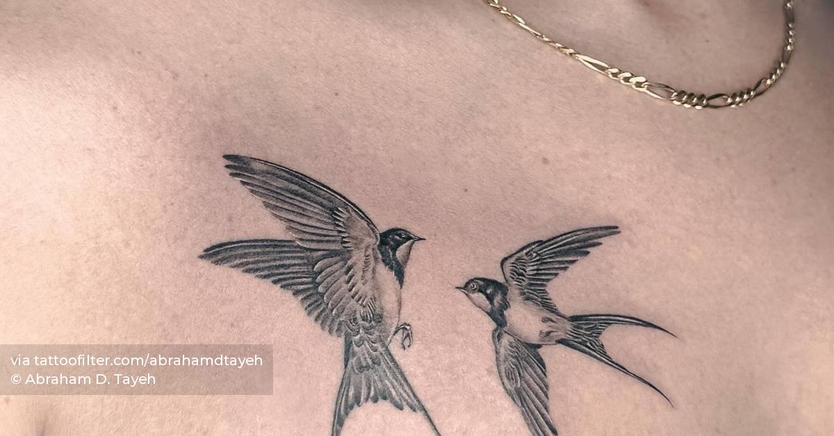 Micro-realistic style swallows tattoo located on the