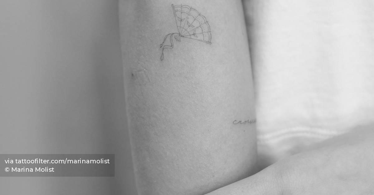 Single needle hand fan tattoo done on the forearm.