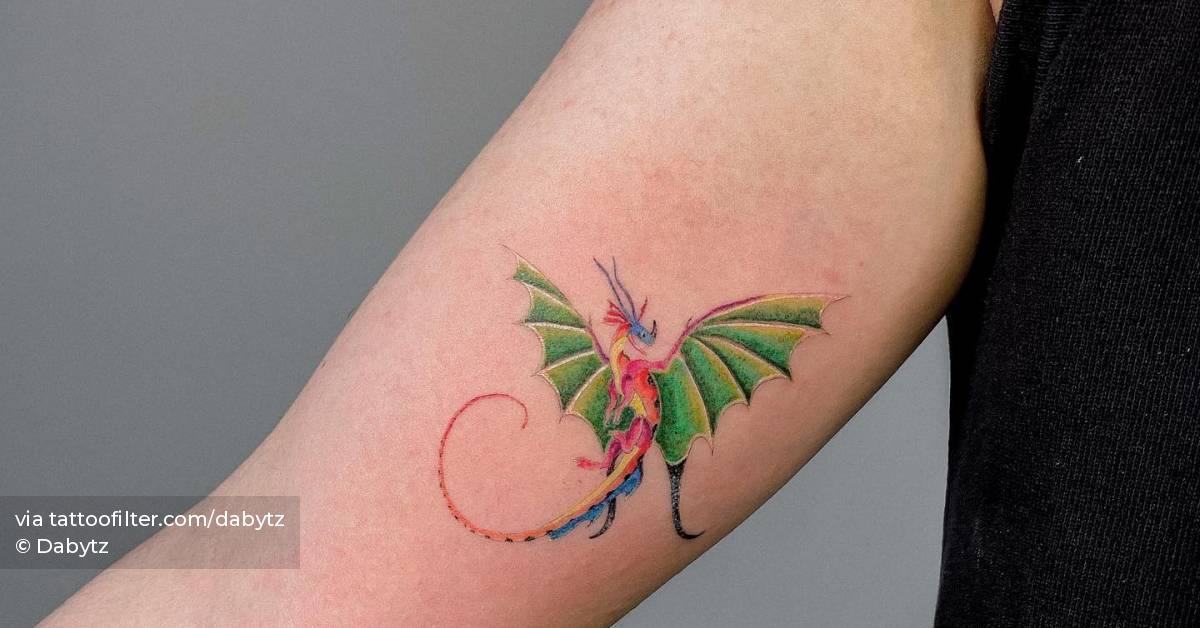 Colorful dragon tattoo done on the inner arm.