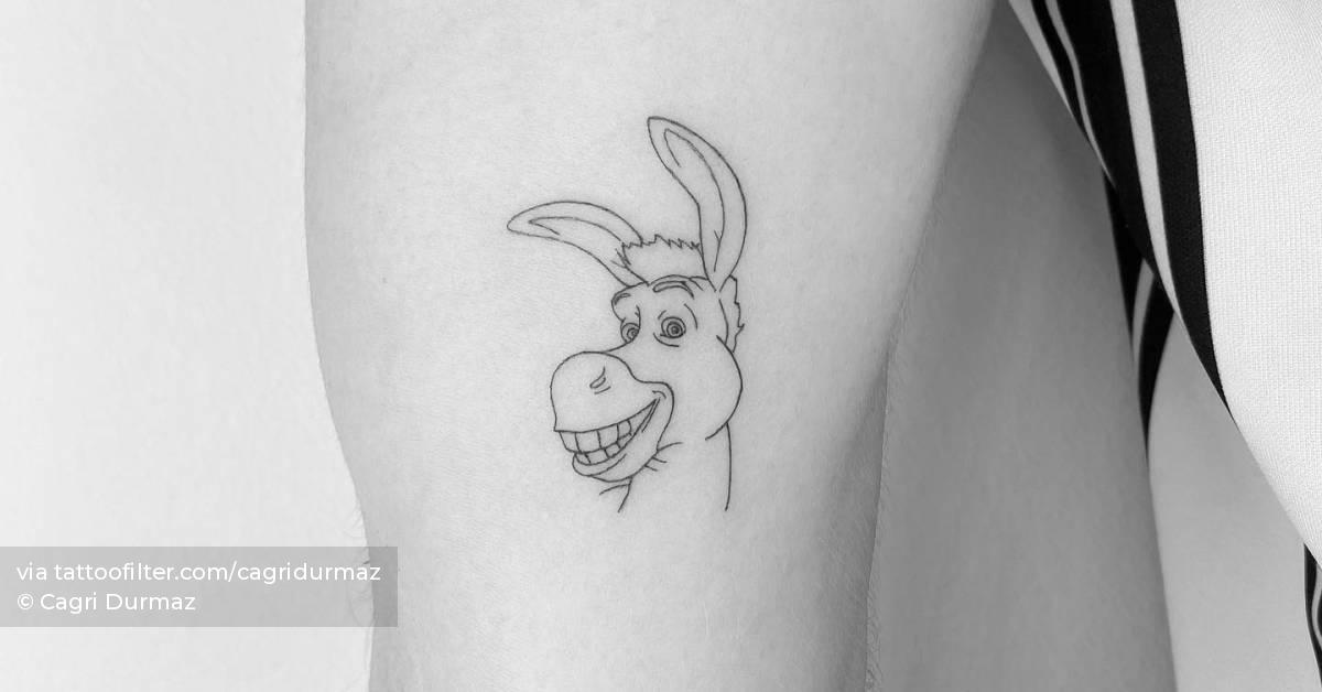Shrek's Donkey tattooed on the inner arm, fine line