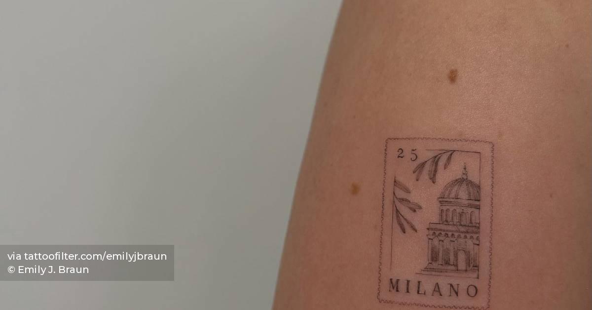 Duomo di Milano stamp tattoo located on the upper arm.