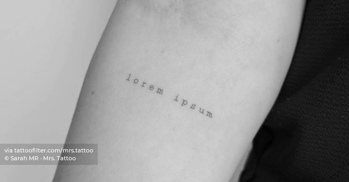 "Lorem ipsum" lettering tattoo located on the inner