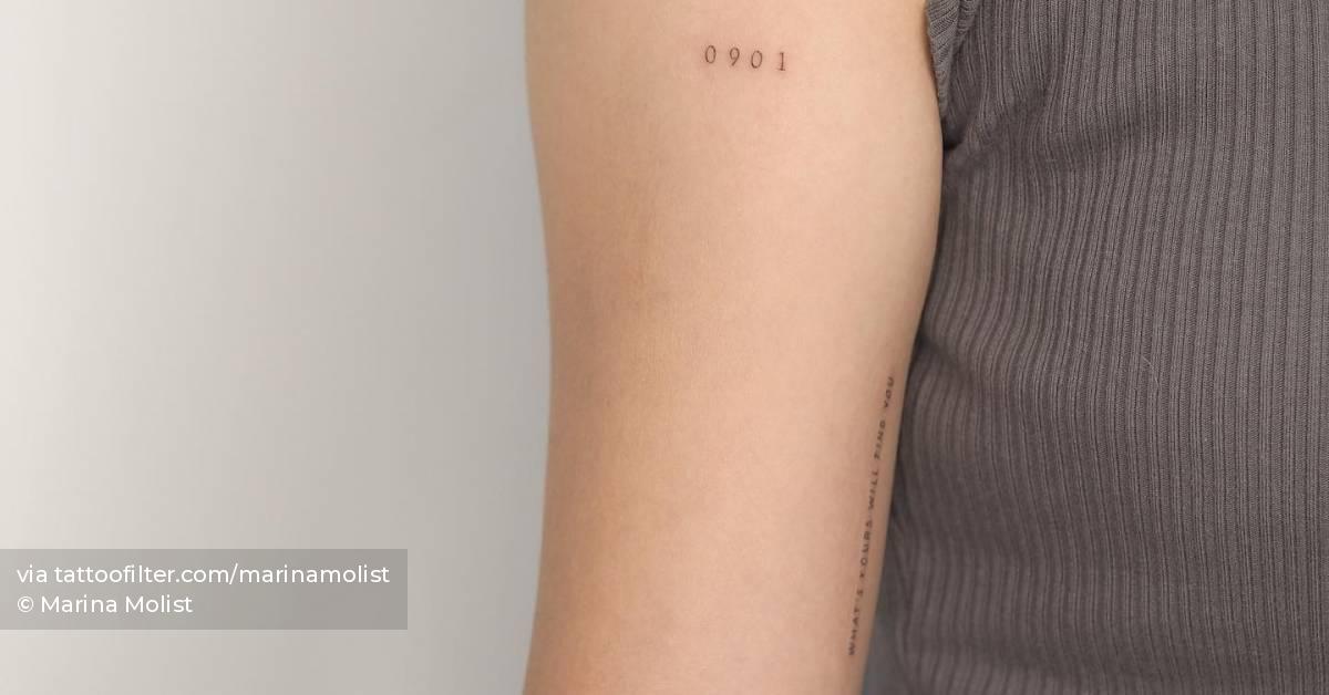 "0901" and flying birds tattooed on the upper arm.