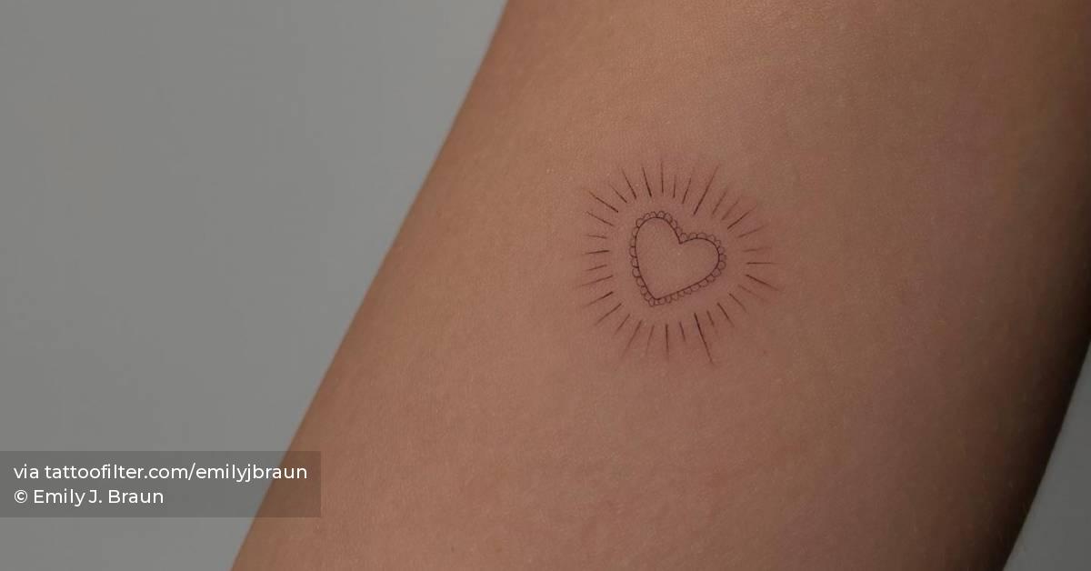 Fine line heart tattoo located on the inner arm.