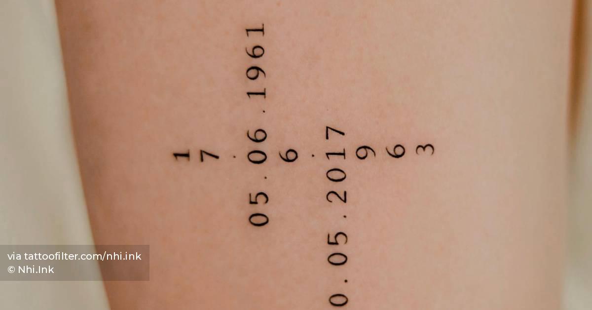 Dates tattooed on the upper arm.