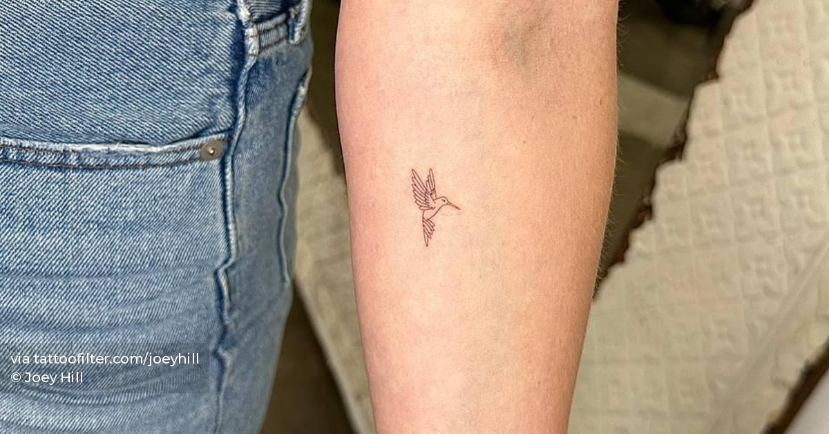 Mini hummingbird tattoo done on the inner forearm.