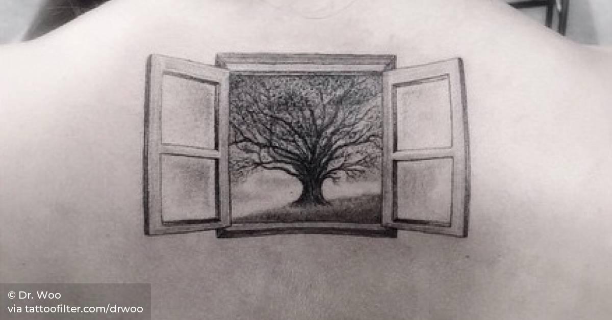 Fine line style window tattoo on the upper back.