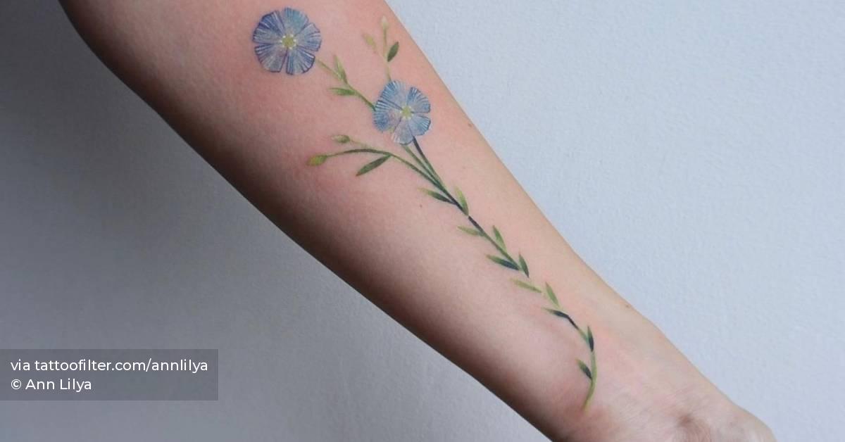 Flax flower tattoo located on the inner forearm,