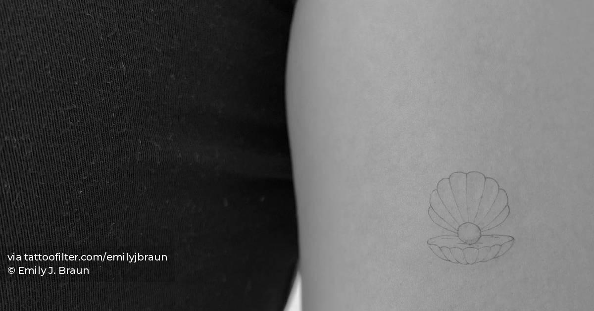 Single needle scallop shell tattoo located on the upper