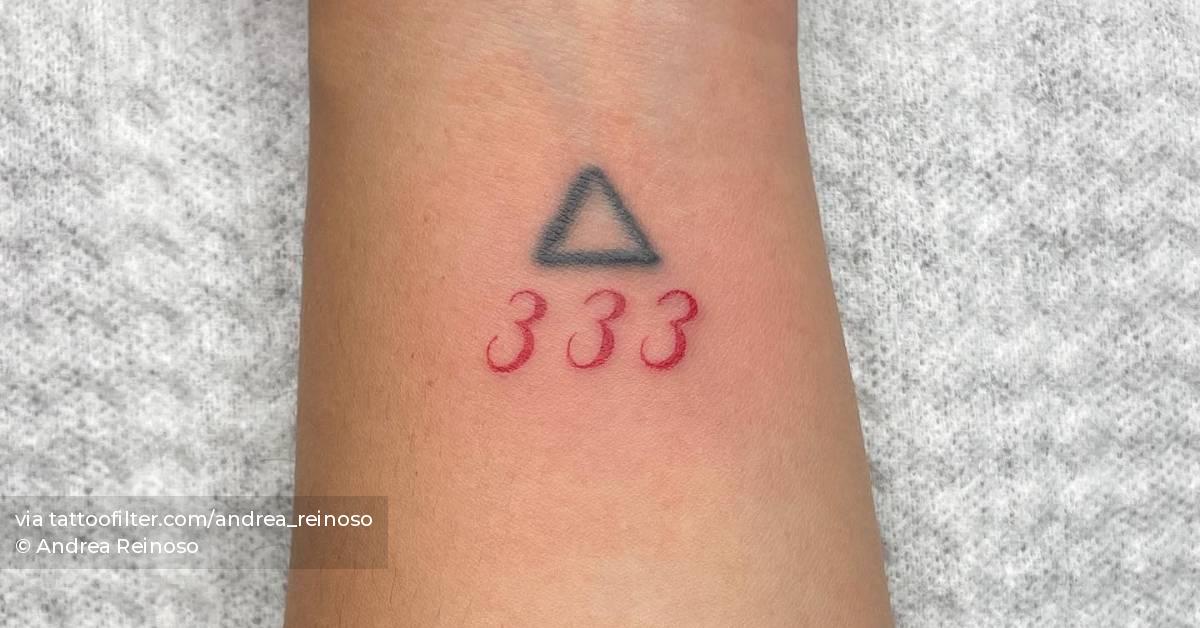 Tattoo of the number "333" in red ink located on the