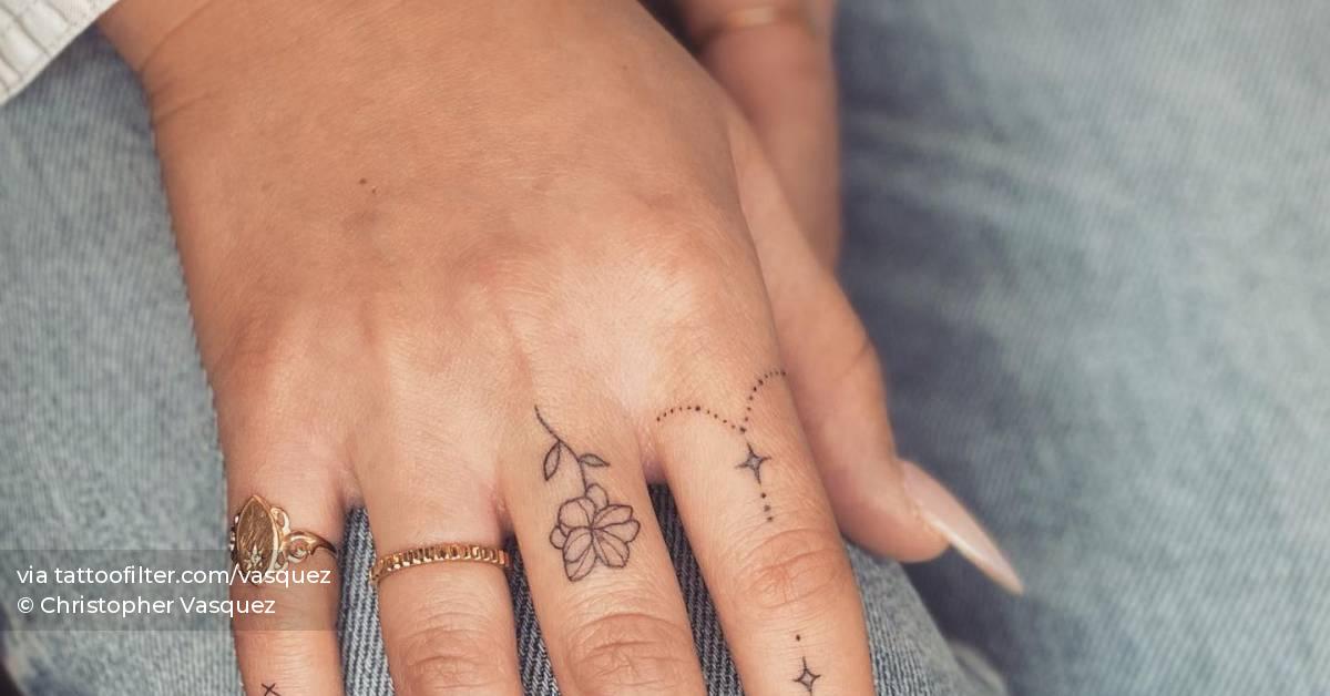 Fine line style finger composition tattoo.