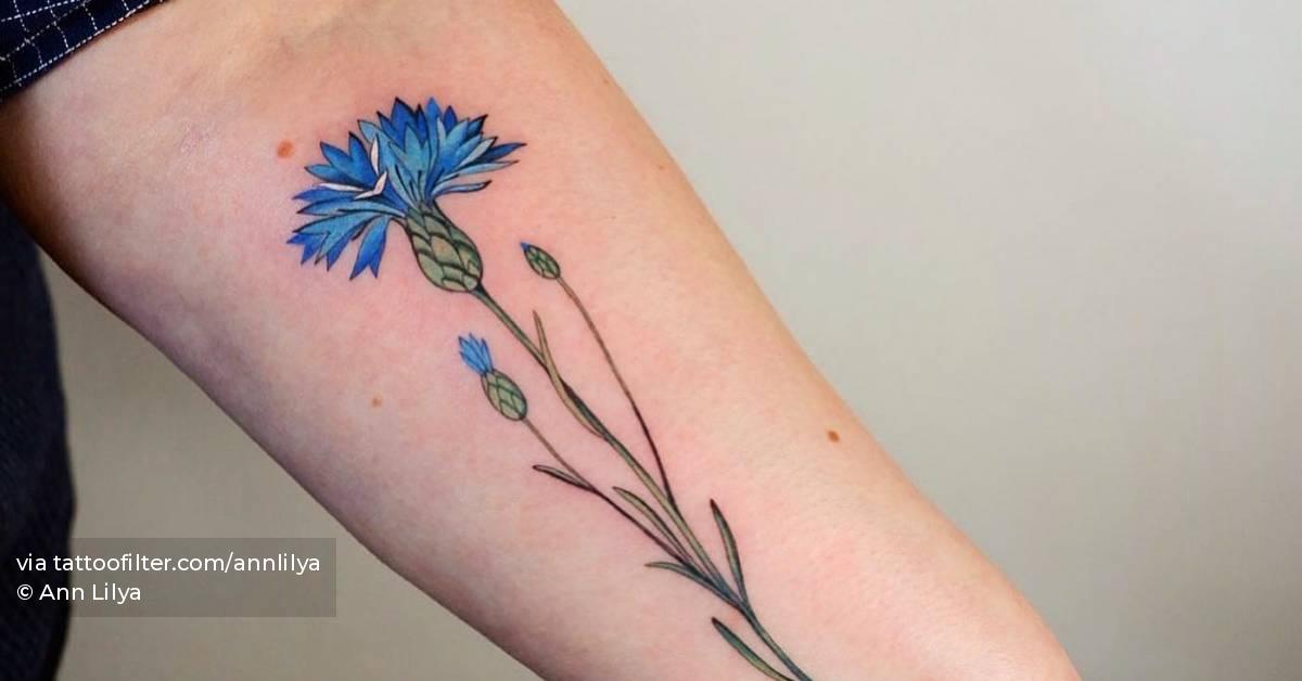 Illustrative style cornflower tattoo located on the