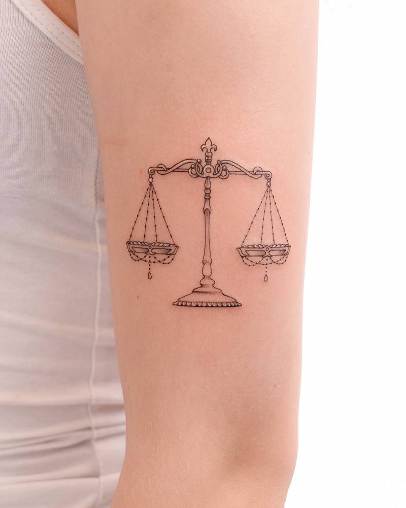 Scale Tattoo Located On The Upper Arm Illustrative Scale Tattoo Located On The Upper Arm Illustrative