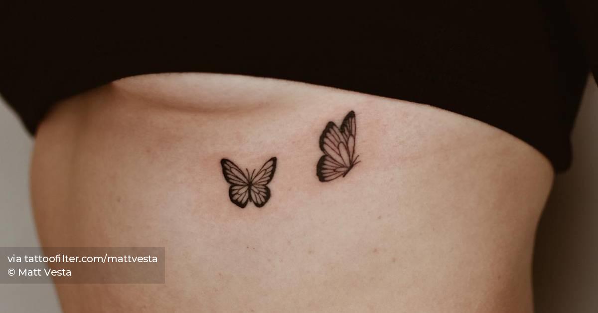 Butterfly couple tattoo located on the rib.