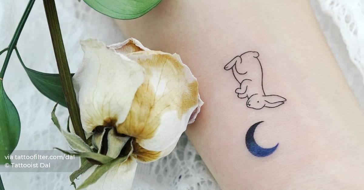 Fine line bunny and minimalistic crescent moon tattooed