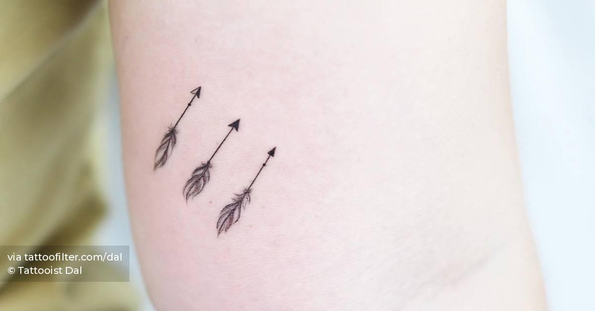 Minimalistic style arrows tattooed on the inner arm.