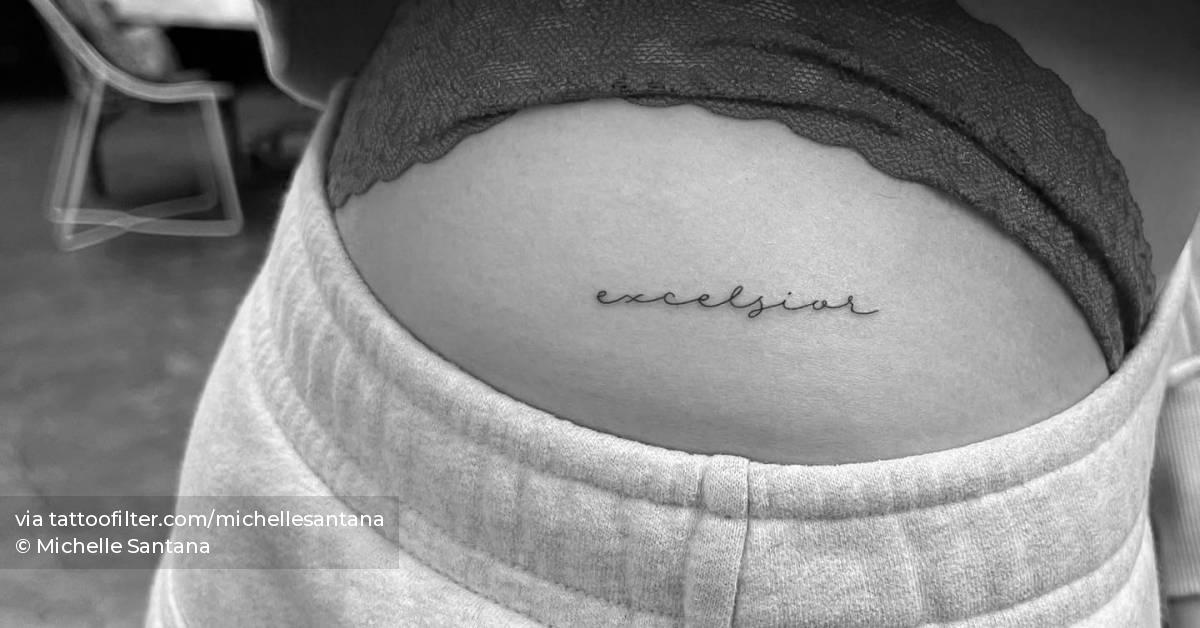 Word "excelsior" tattooed on the hip.