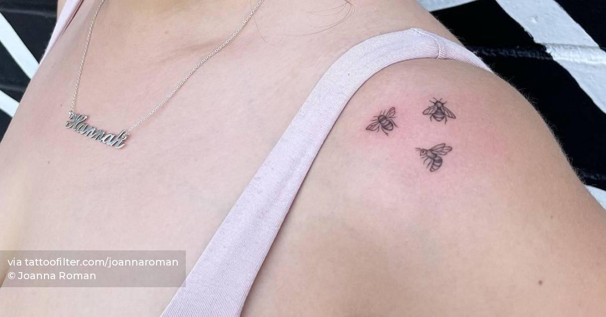 Fine line bees tattoo on the shoulder.
