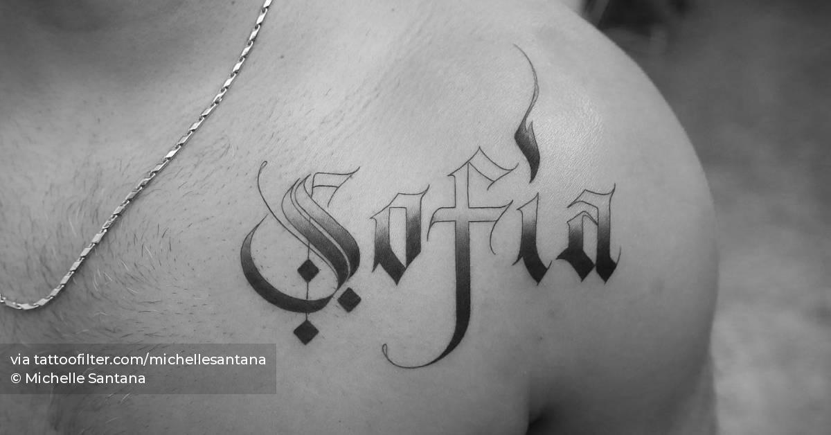 Tattoo of the name "Sofia" located on the chest and