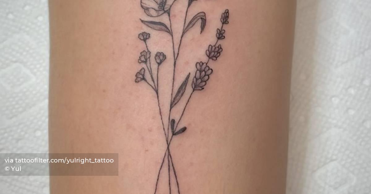 FIne line flower bouquet tattoo on the tricep.