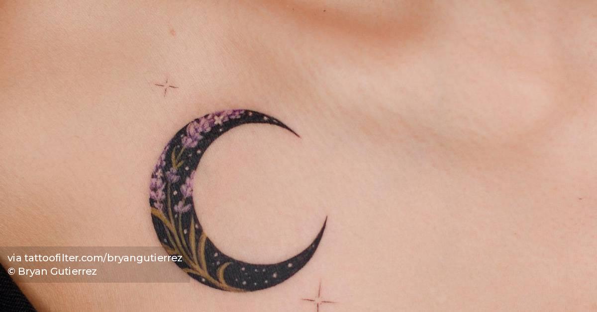 Lavender flower moon tattooed on the collarbone.