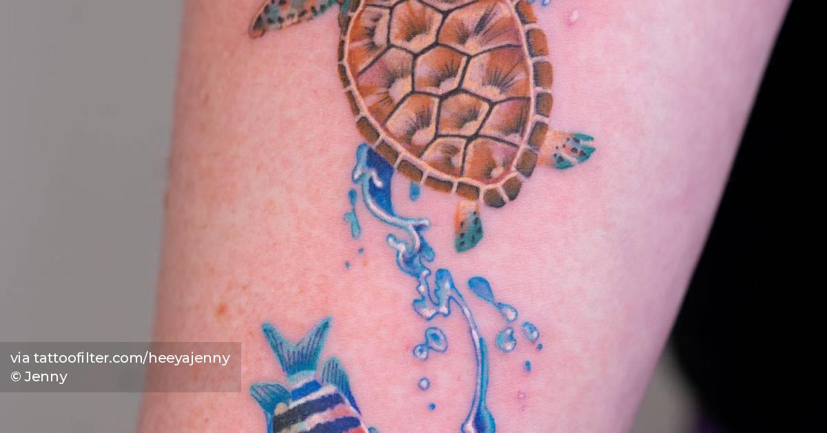 Turtle and fish tattoo done on the inner forearm,