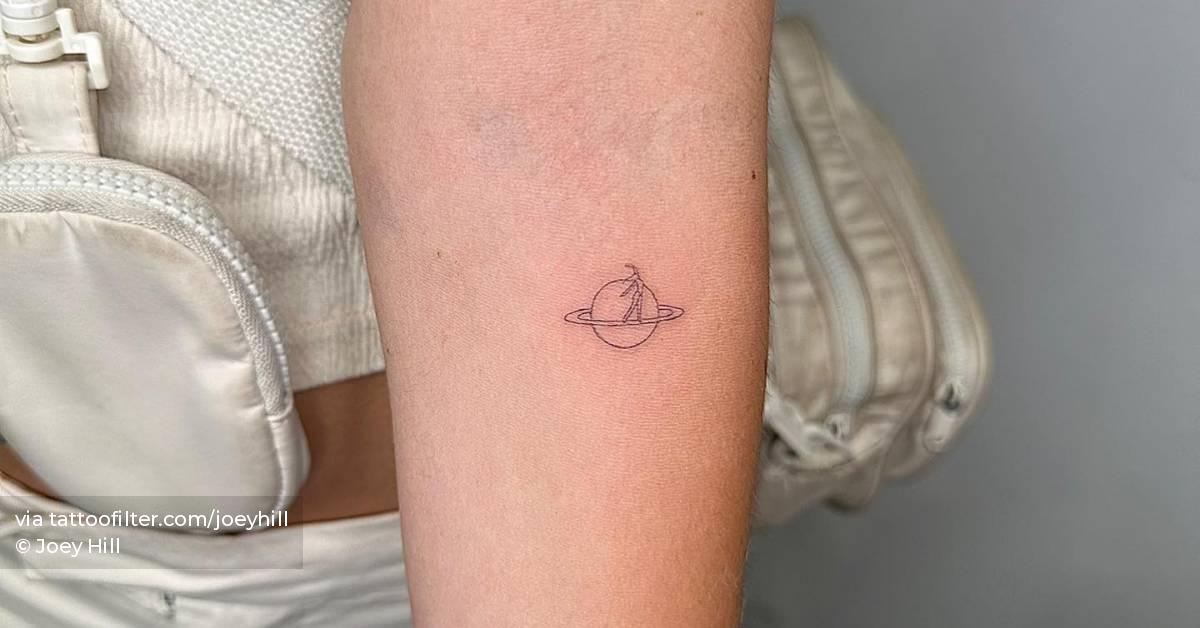 Fine line style Saturn dancer located on the inner